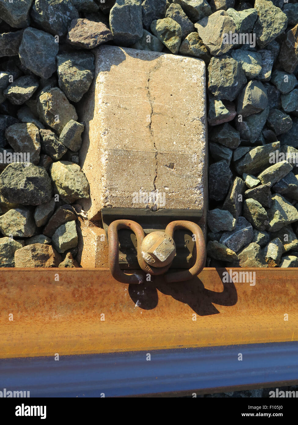 Concrete railway sleepers with iron clip fastener Stock Photo - Alamy