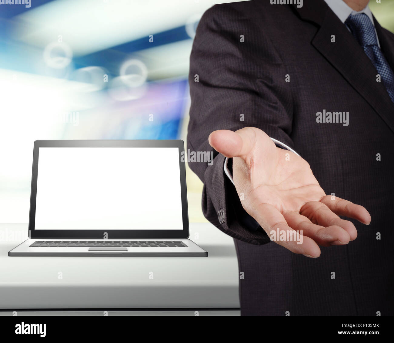 businessman and blank laptop computer in shop background as concept ...