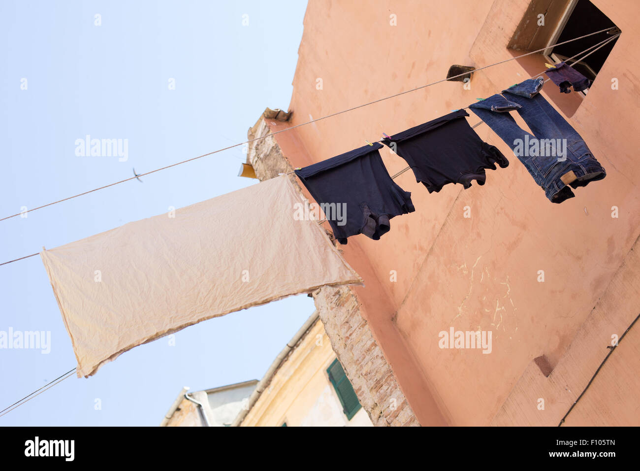 Clothes hanging for drying at the backyard on the streets of Corfu town ...
