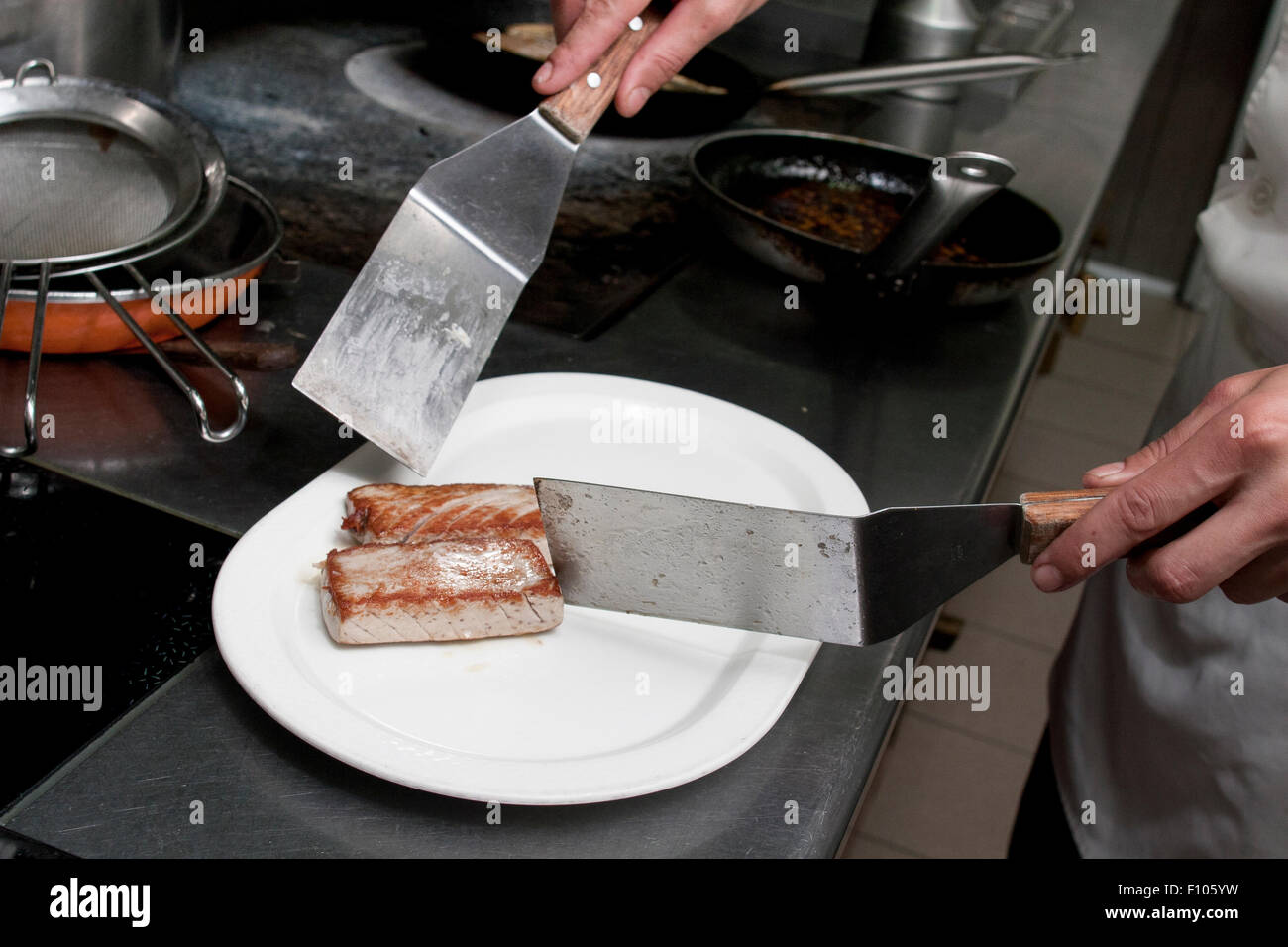 fried bricks of tuna meat on plate Stock Photo - Alamy