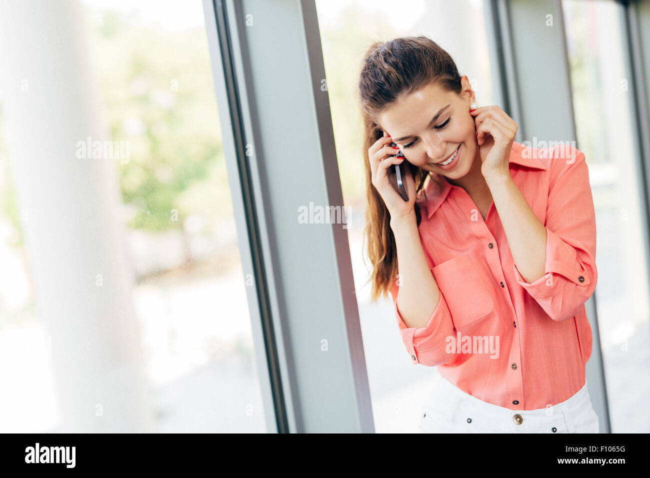 Beautiful women using phone and being verry happy Stock Photo - Alamy