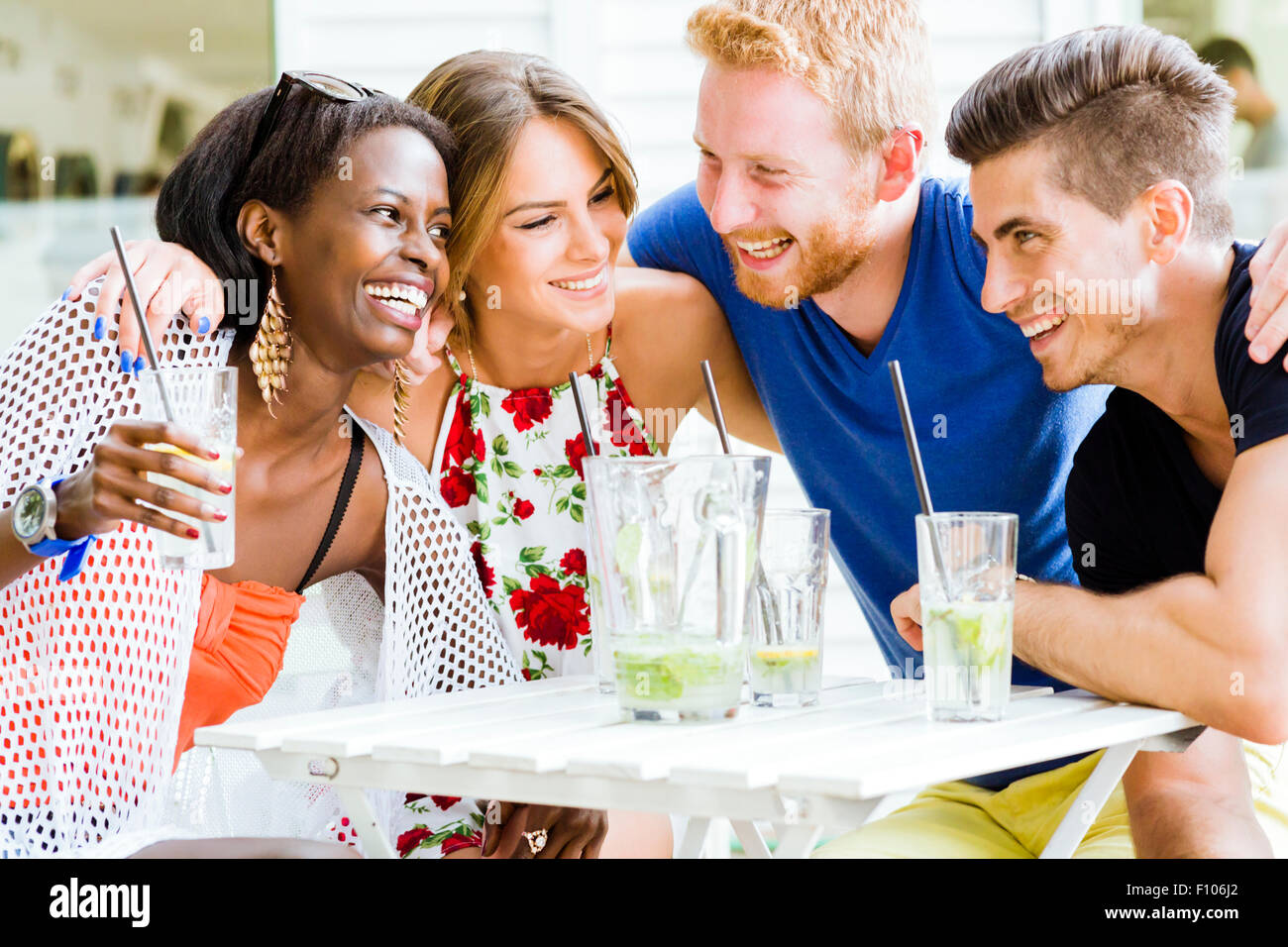 Smiling friends hugging hi-res stock photography and images - Alamy