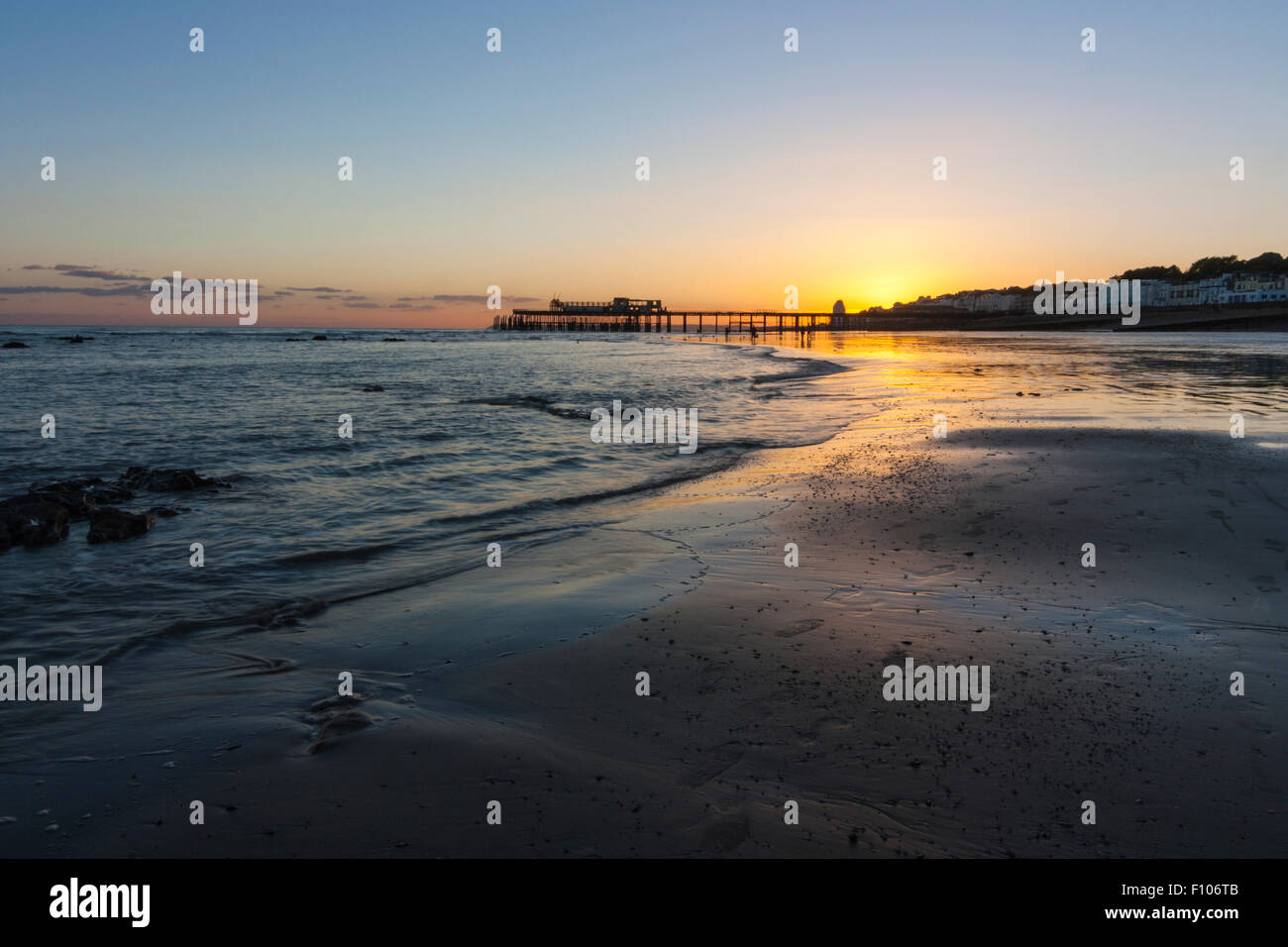 Silhouette hastings pier beach sunset hi-res stock photography and ...