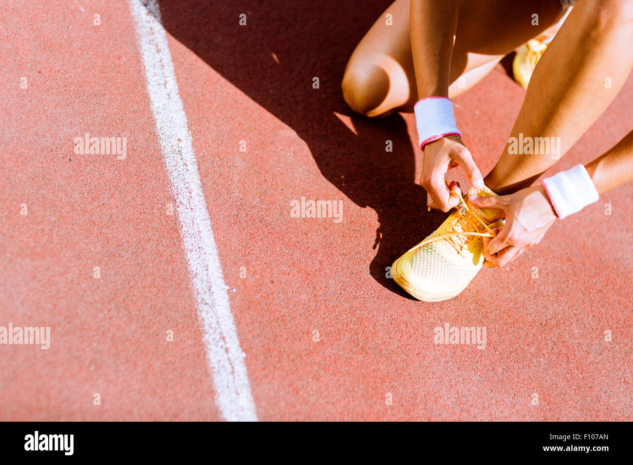 Athlete tying shoe lace hands hi-res stock photography and images - Alamy
