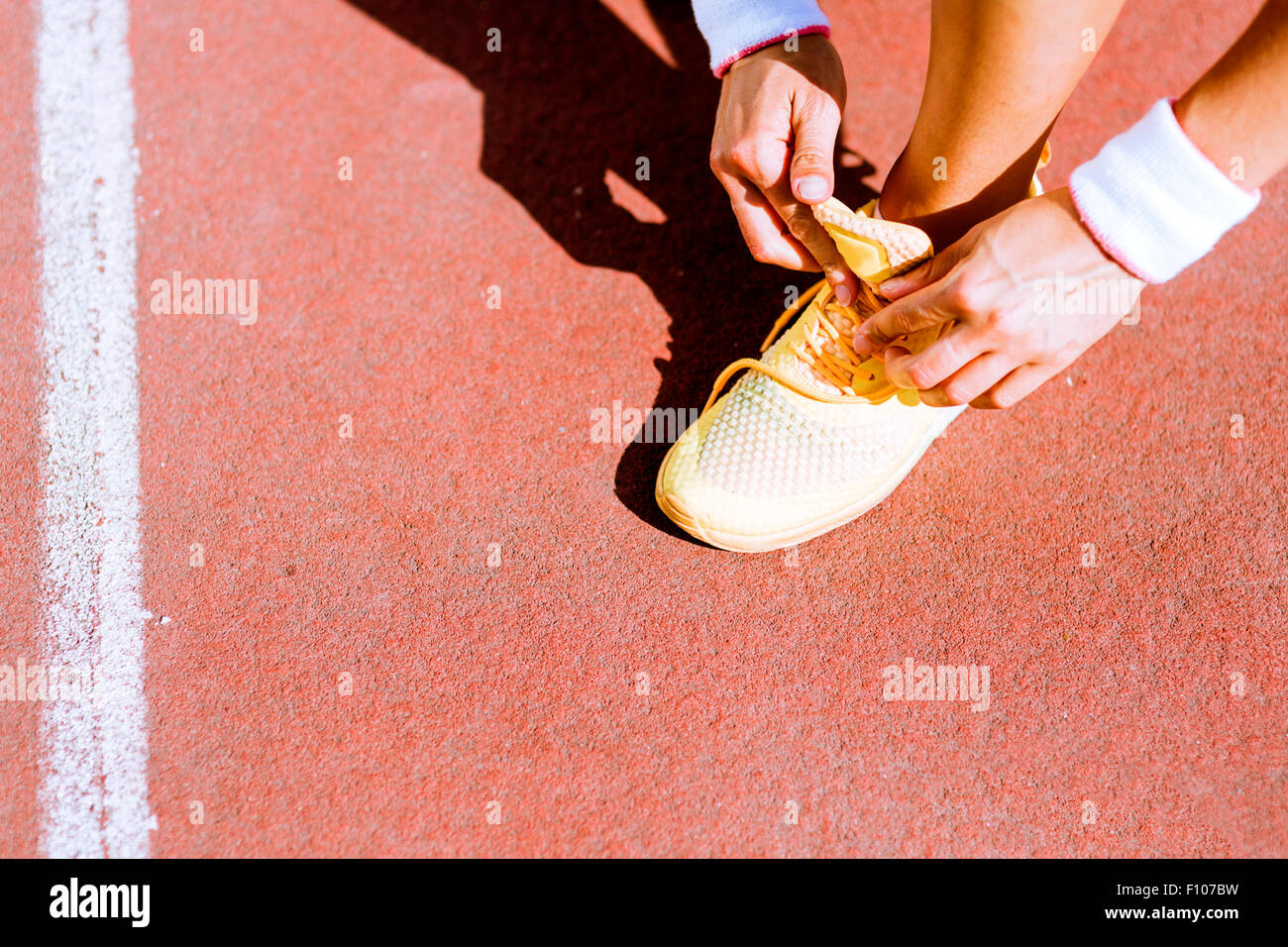 Athlete tying shoe lace hands hi-res stock photography and images - Alamy