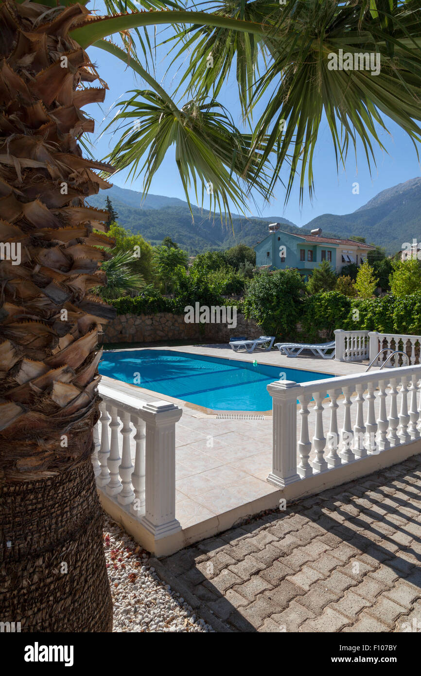 Swimming pool in Ovacik Turkey with Villa in background Stock Photo - Alamy