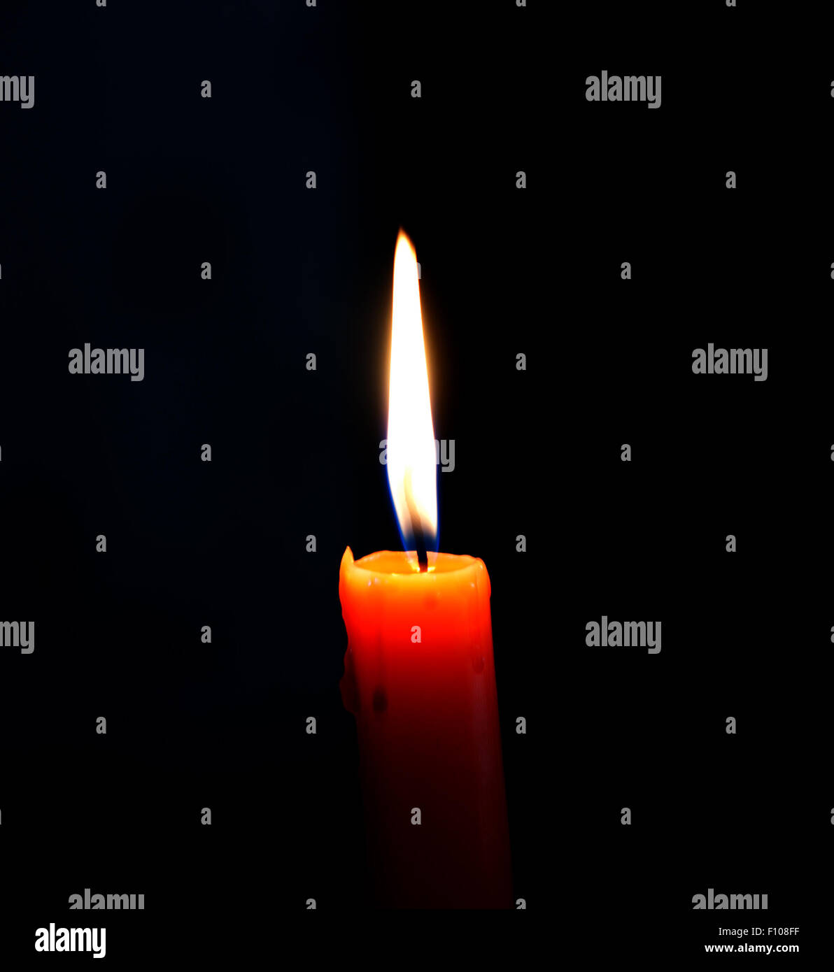 alight candle over the black background Stock Photo - Alamy