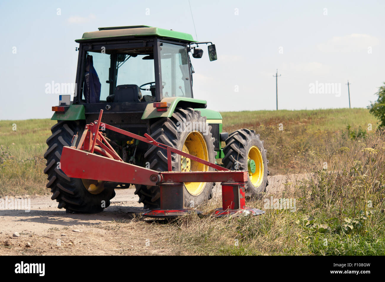 mowing grass shoulder along roadside Stock Photo - Alamy