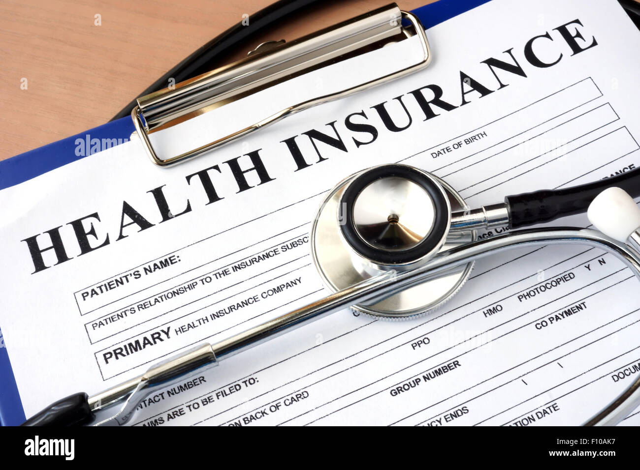 Health insurance form with stethoscope Stock Photo - Alamy