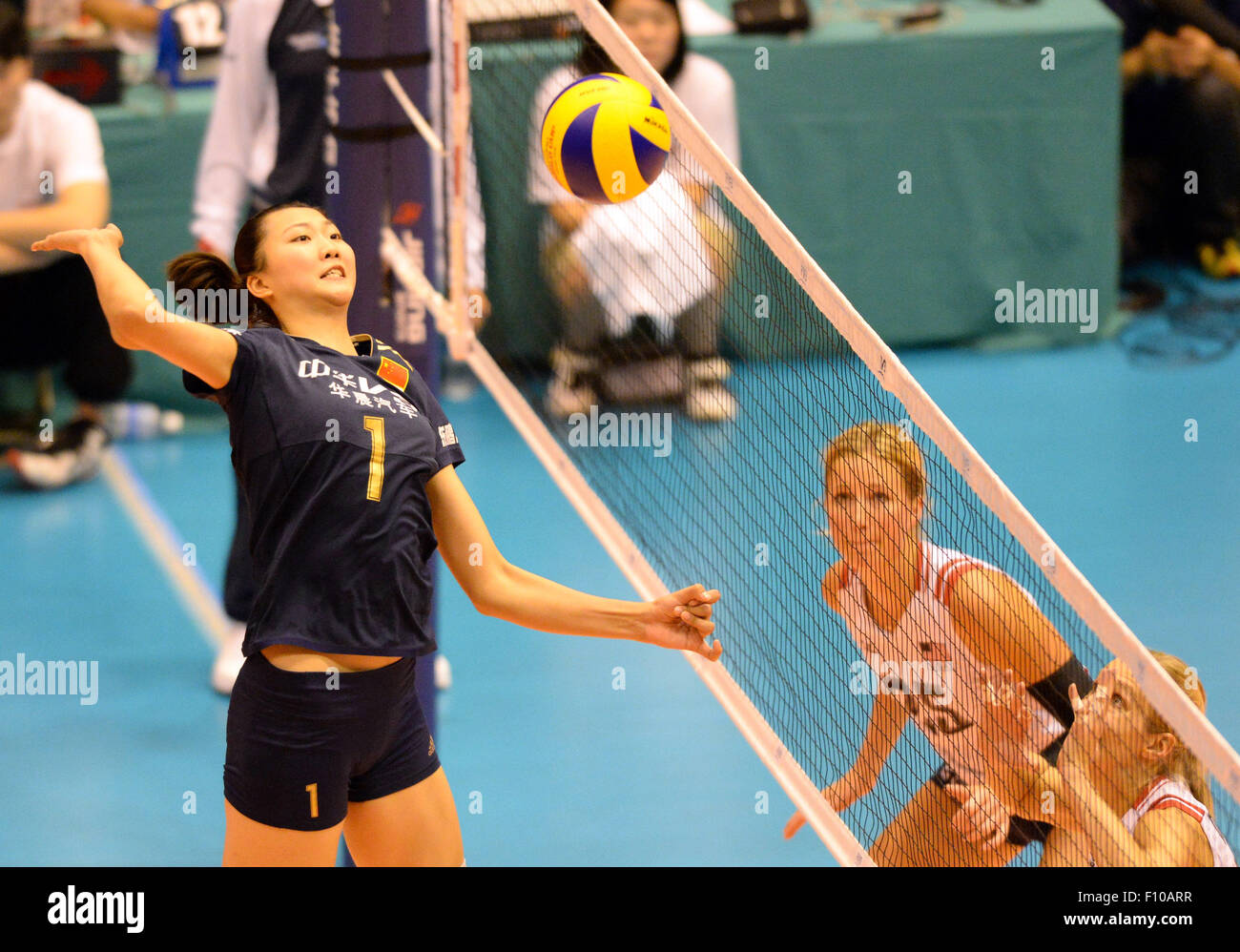 Matsumoto, Japan. 24th Aug, 2015. Yuan Xinyue (L) of China spikes the ...
