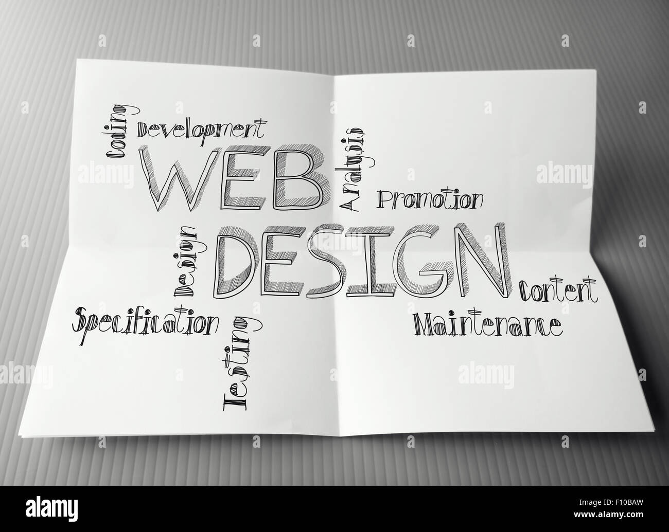 hand drawn web design diagram on crumpled paper background as concept ...