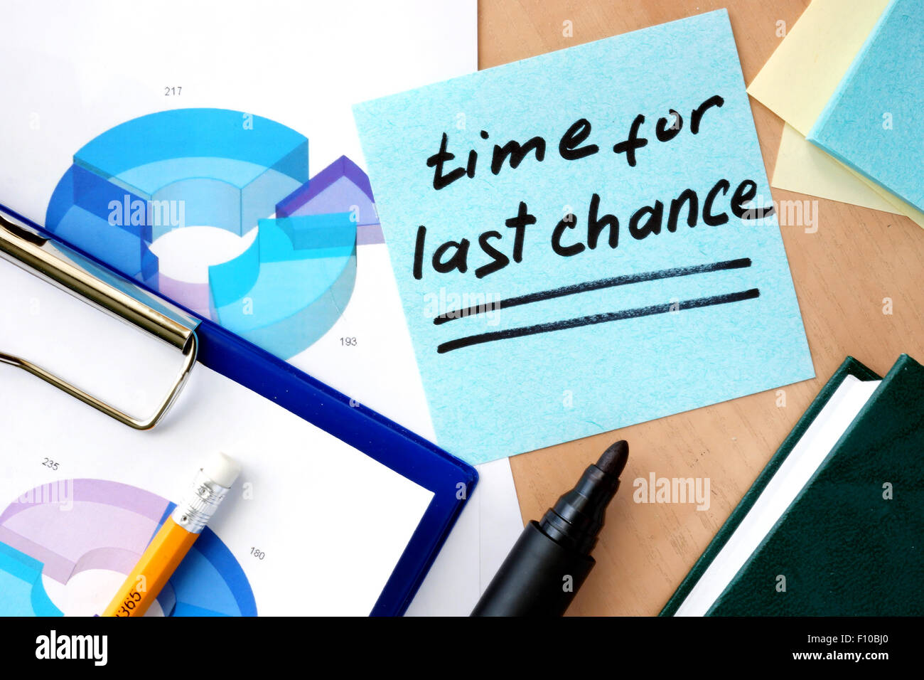 Paper with words time for last chance and charts Stock Photo - Alamy