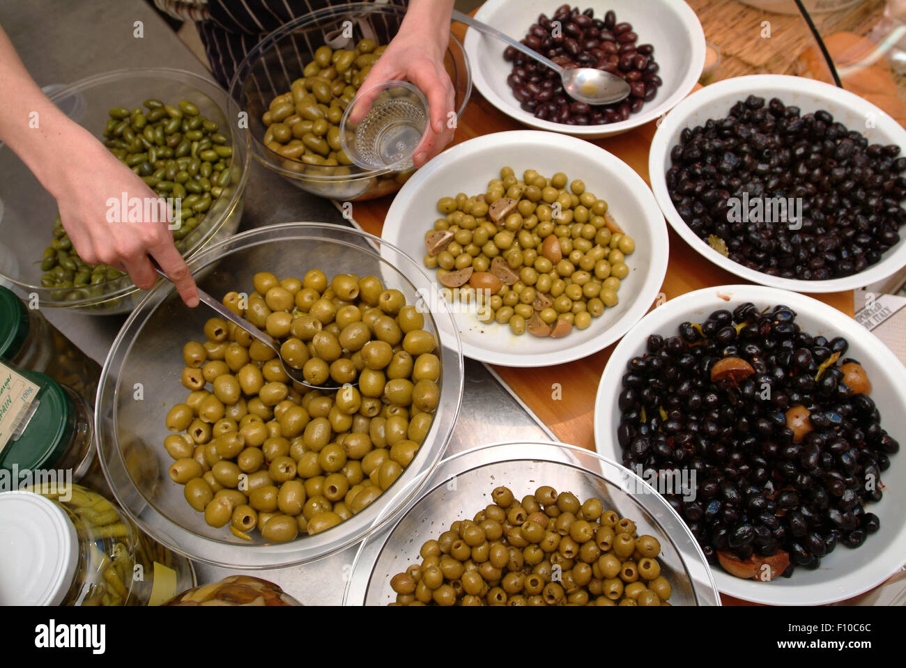 A section of olives in bowls in a delicatessen Stock Photo - Alamy