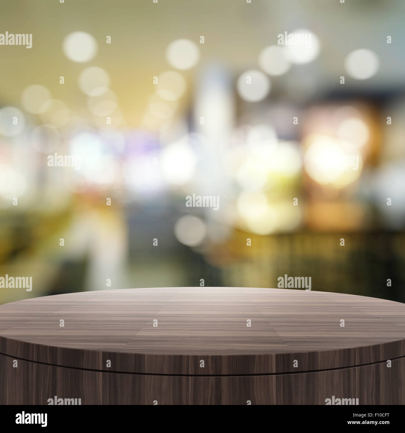 Empty wooden round table and blurred background for product ...