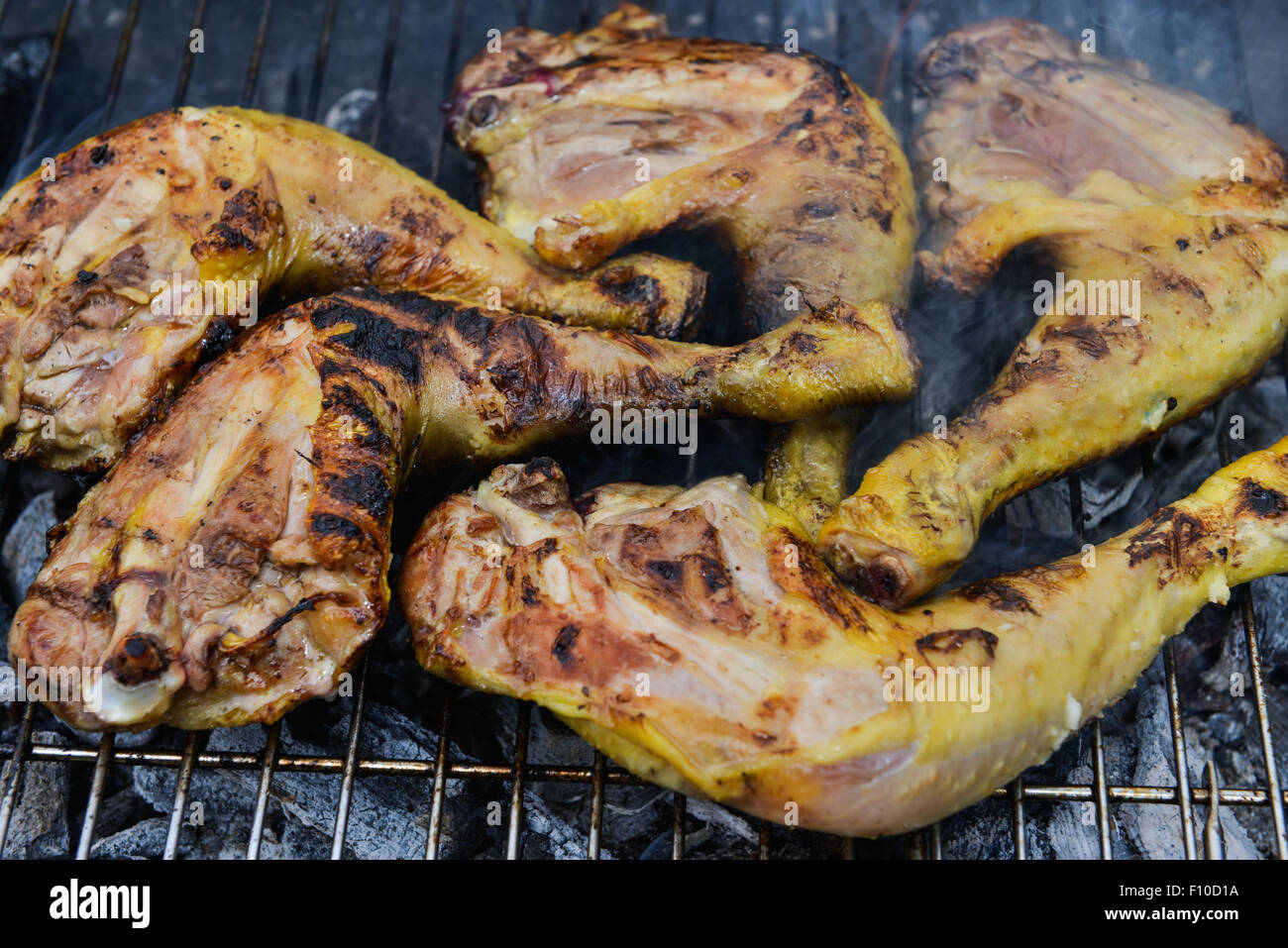 Roasted chicken leg on a wood fire on grill Stock Photo - Alamy