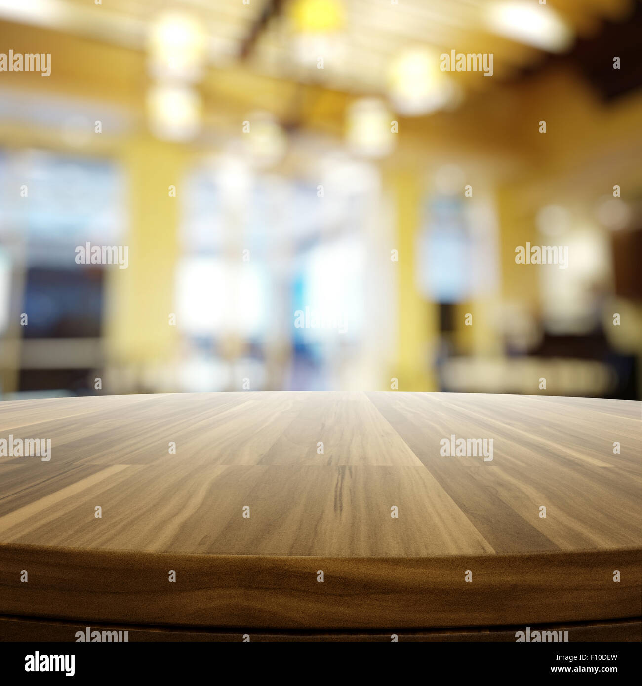 Empty wooden round table and blurred background for product ...