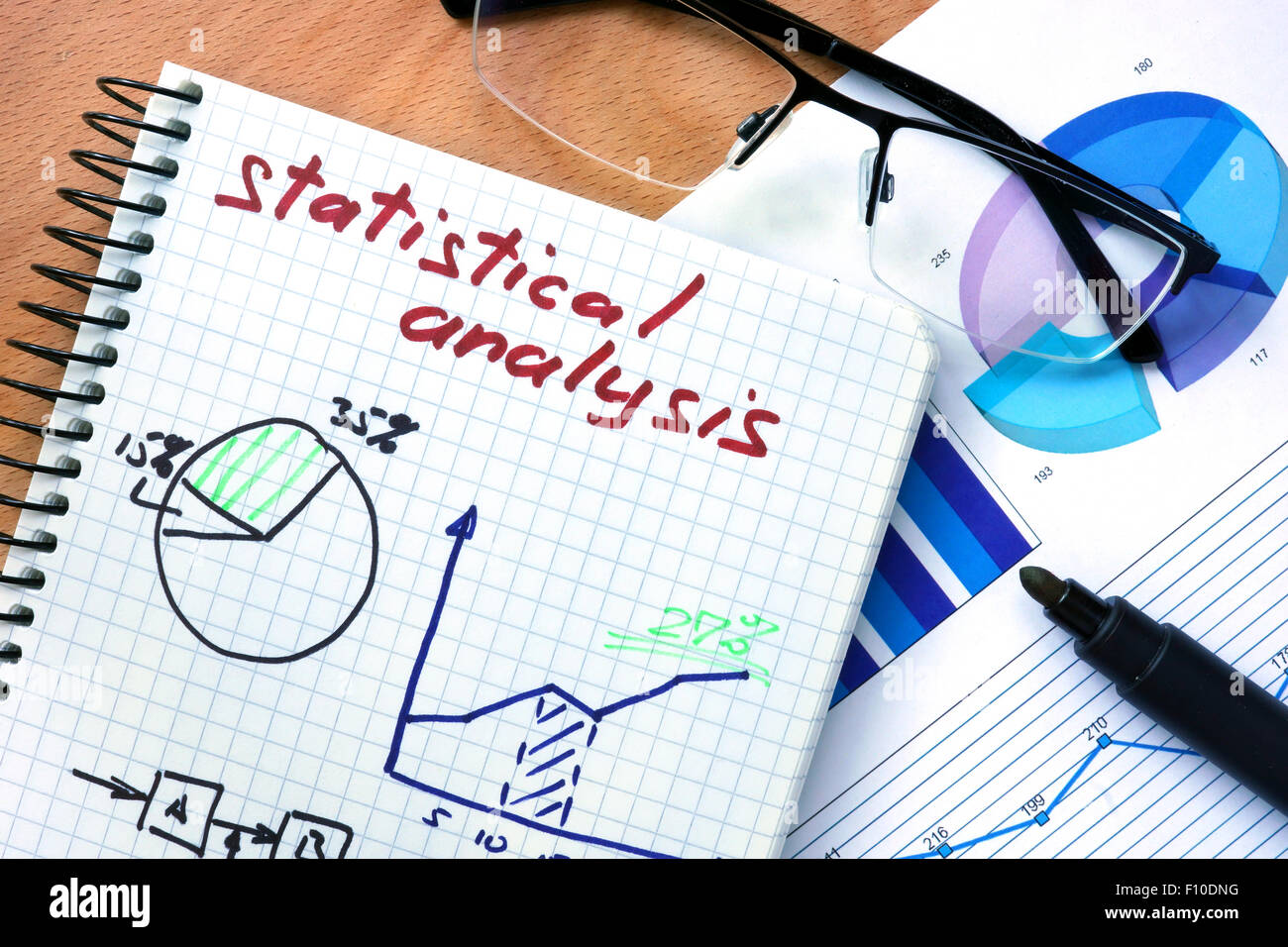 Notepad with words statistical analysis on a wooden background Stock ...