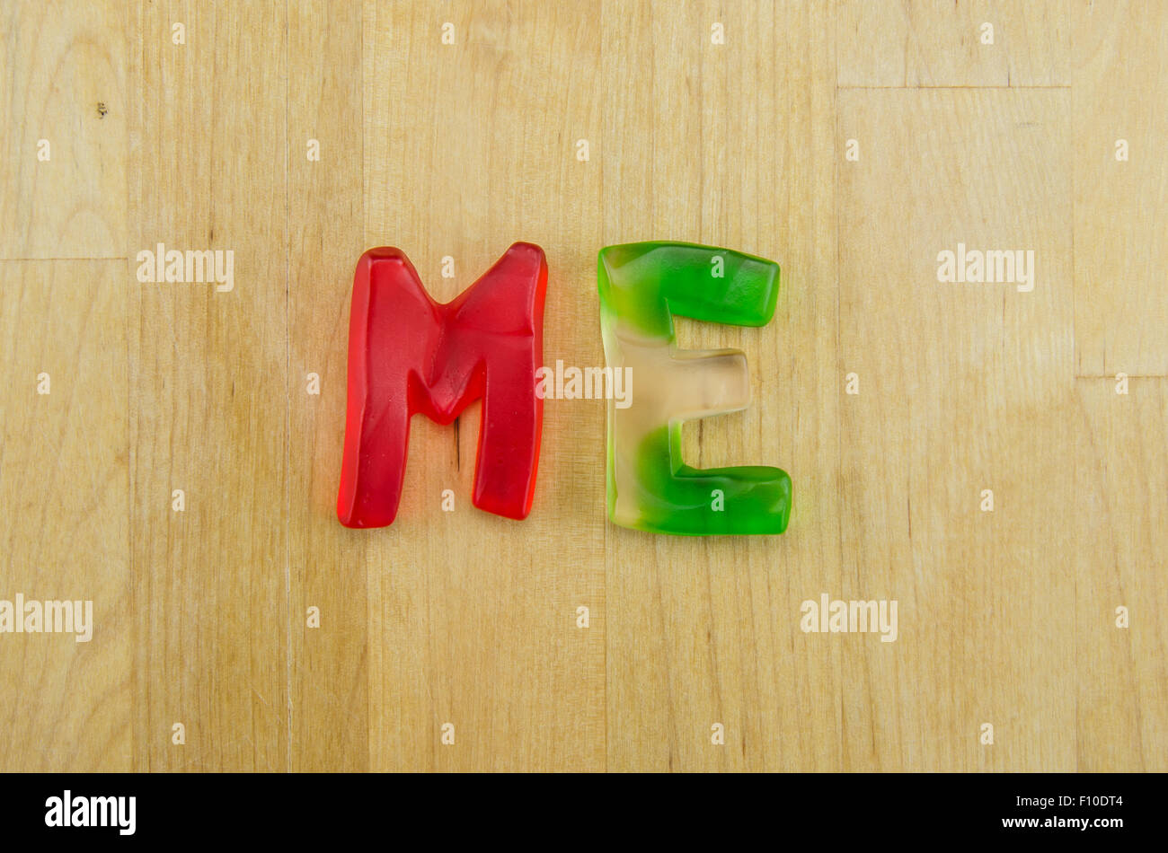 Multi colored gummy letters spell the word me Stock Photo - Alamy