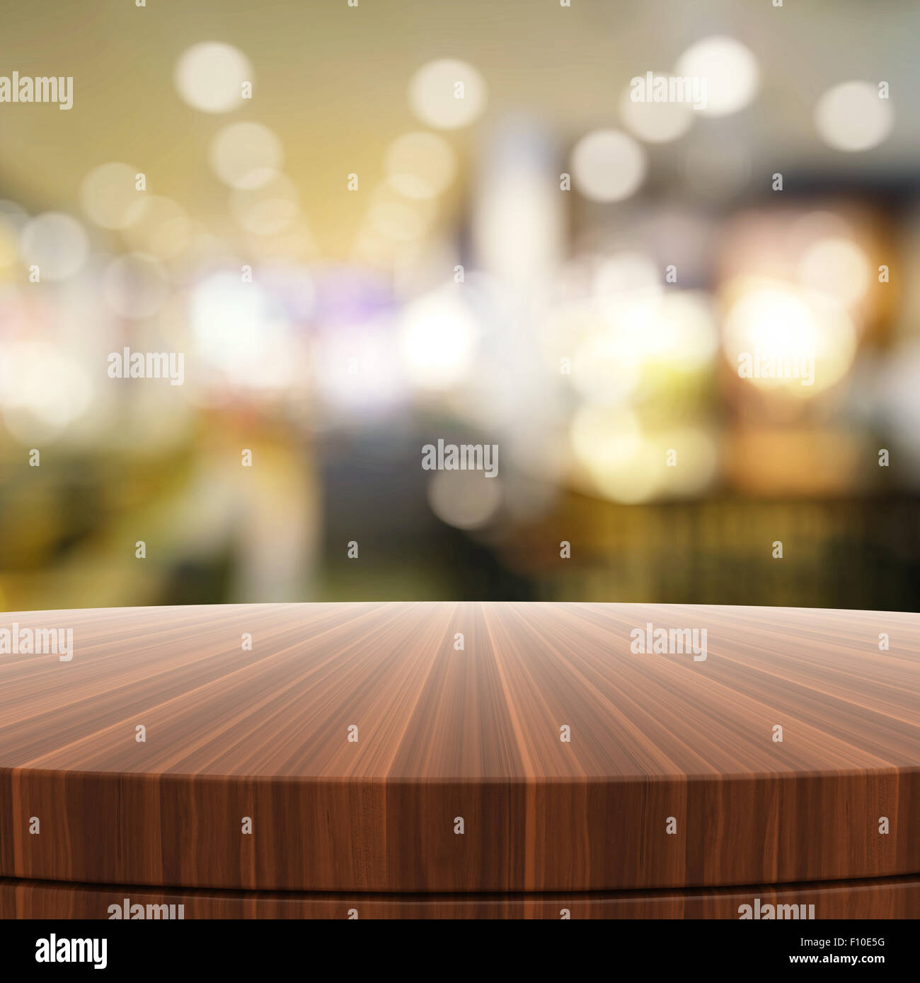 Empty wooden round table and blurred background for product ...