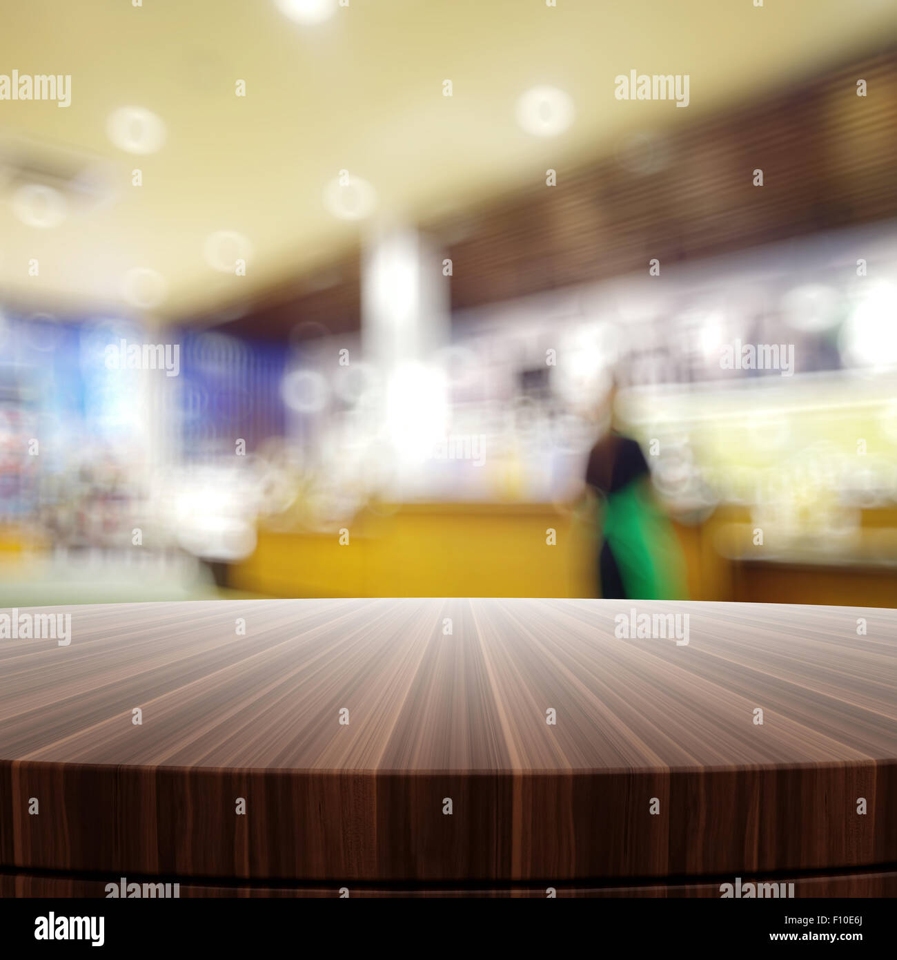 Empty wooden round table and blurred background for product ...