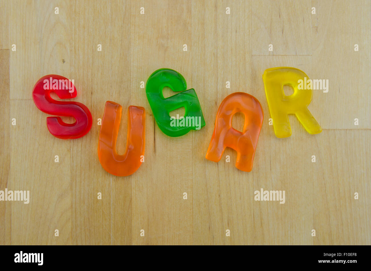 Scattered multi colored gummy letters spell the word sugar Stock Photo ...