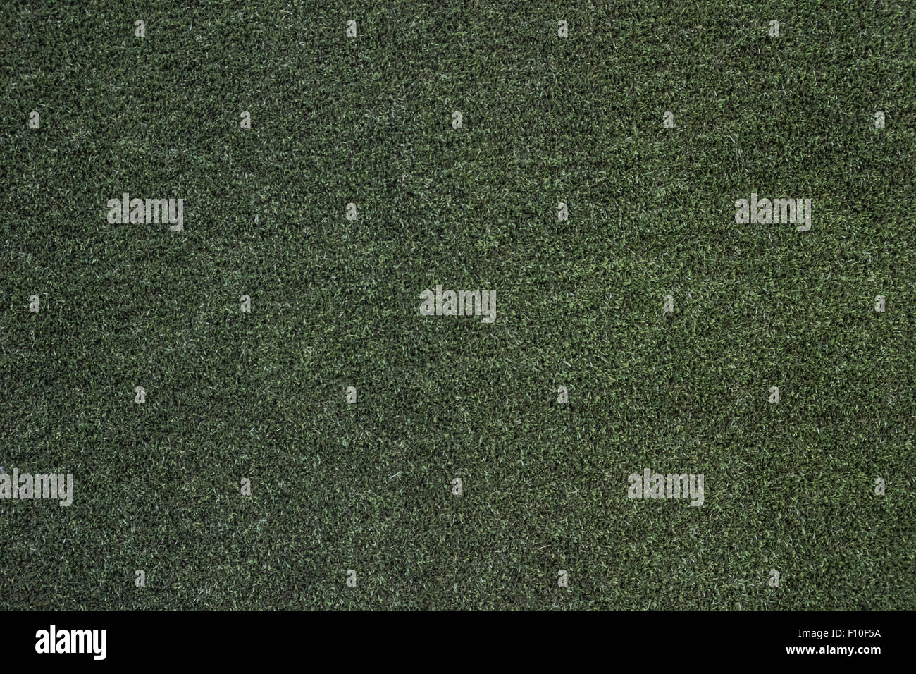 A wall of artificial turf grass background Stock Photo - Alamy