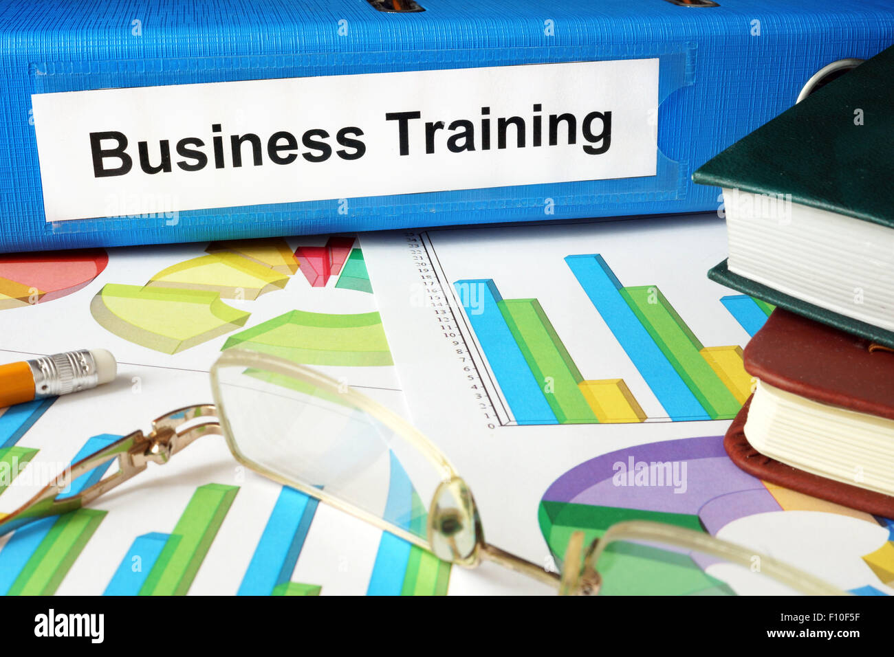 Folder with label Business Training and charts Stock Photo - Alamy