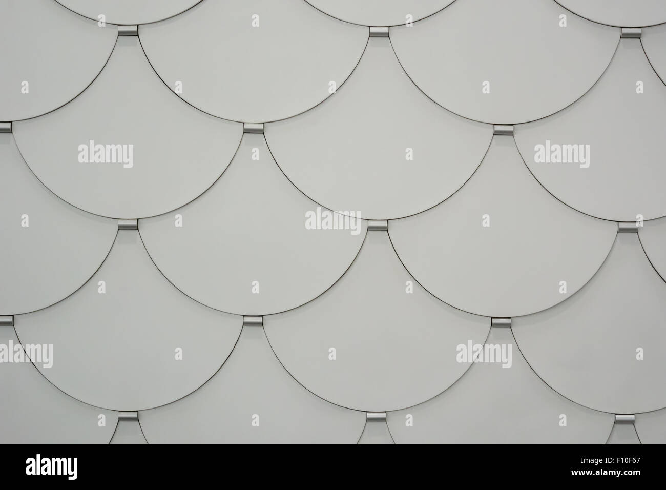 A wall in a business center is marked with circles layered to create a ...