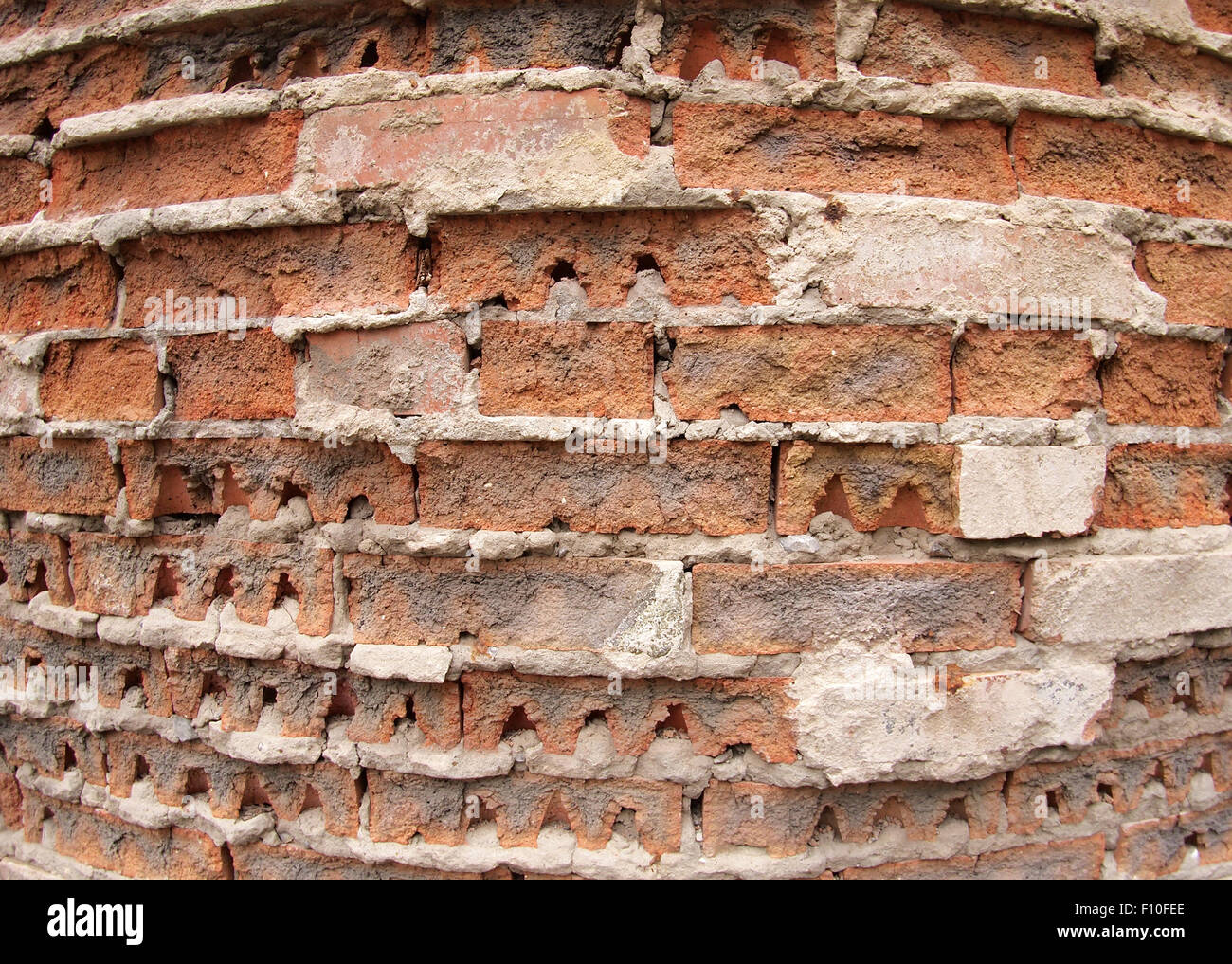Fragment of the old wall of the destroyed bricks with wide angle ...