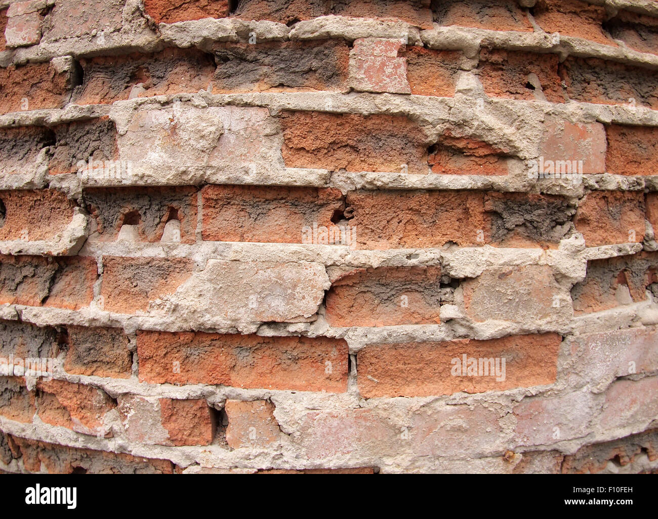 Fragment of the old wall of the destroyed bricks with wide angle ...