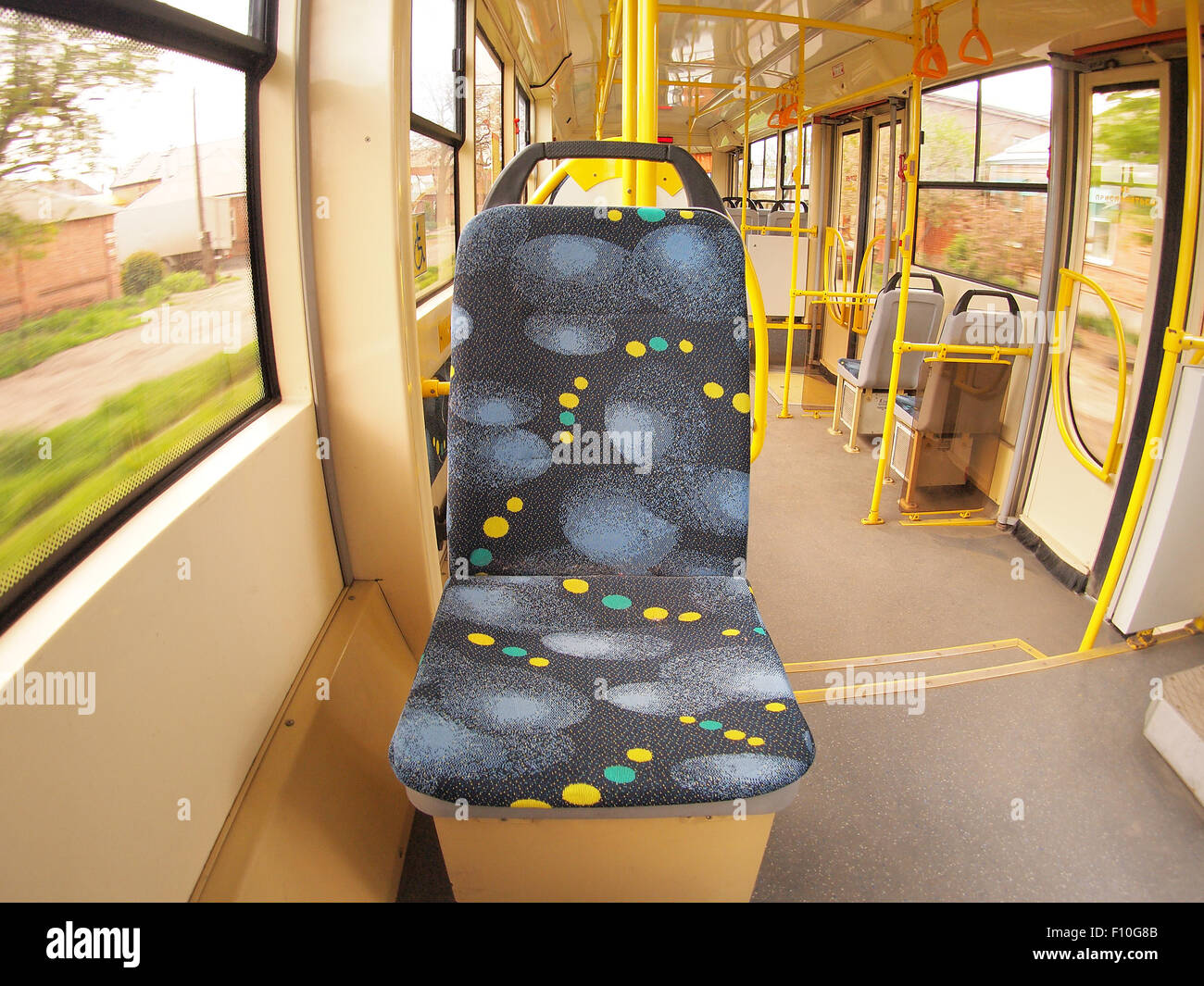 Empty tram rides through the streets of the city - inside view with ...