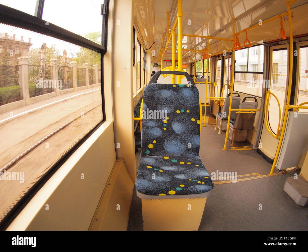 Empty tram rides through the streets of the city - inside view with ...
