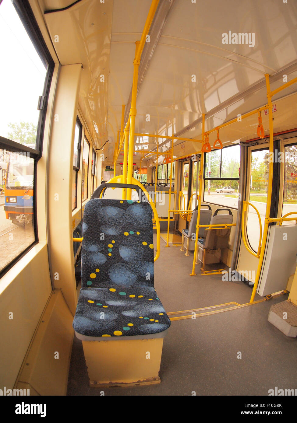 Empty tram rides on the streets of the city - inside view with wide ...