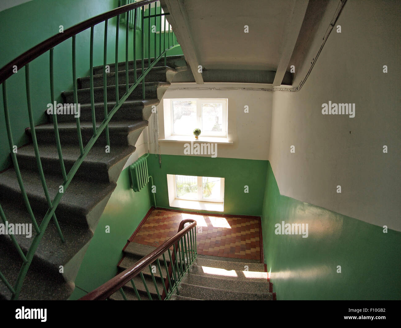 The interior staircase between floors in high-rise building with wide ...