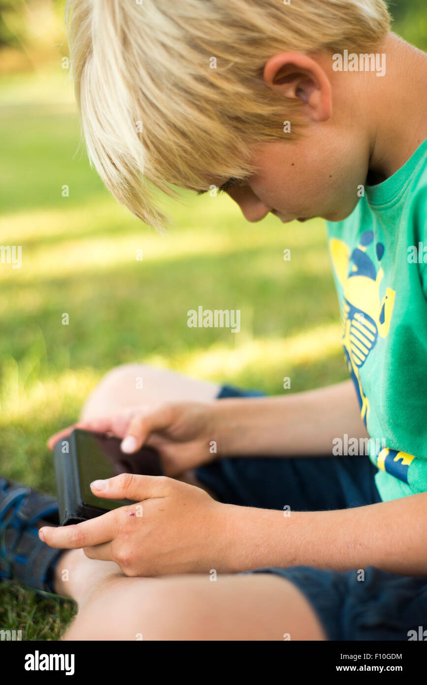 Boy playing game on mobile hi-res stock photography and images - Alamy