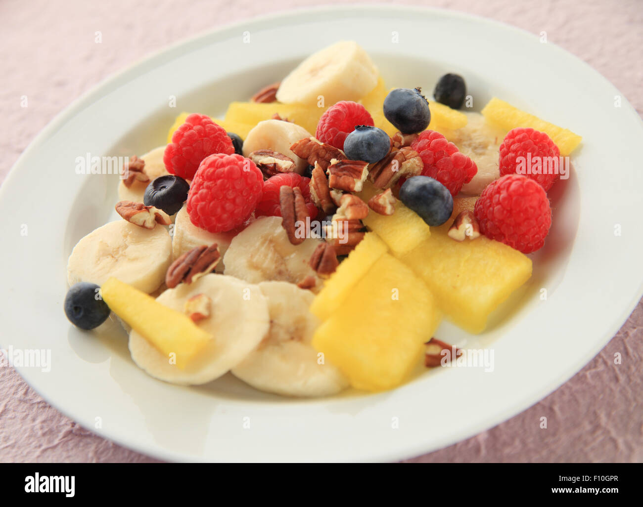 Fresh raspberries, blueberries, bananas and watermelon topped with ...