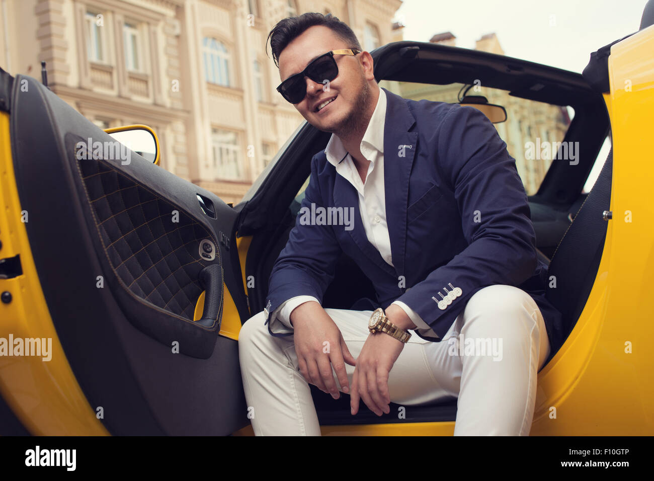 Stylish man sitting in sport car Stock Photo - Alamy
