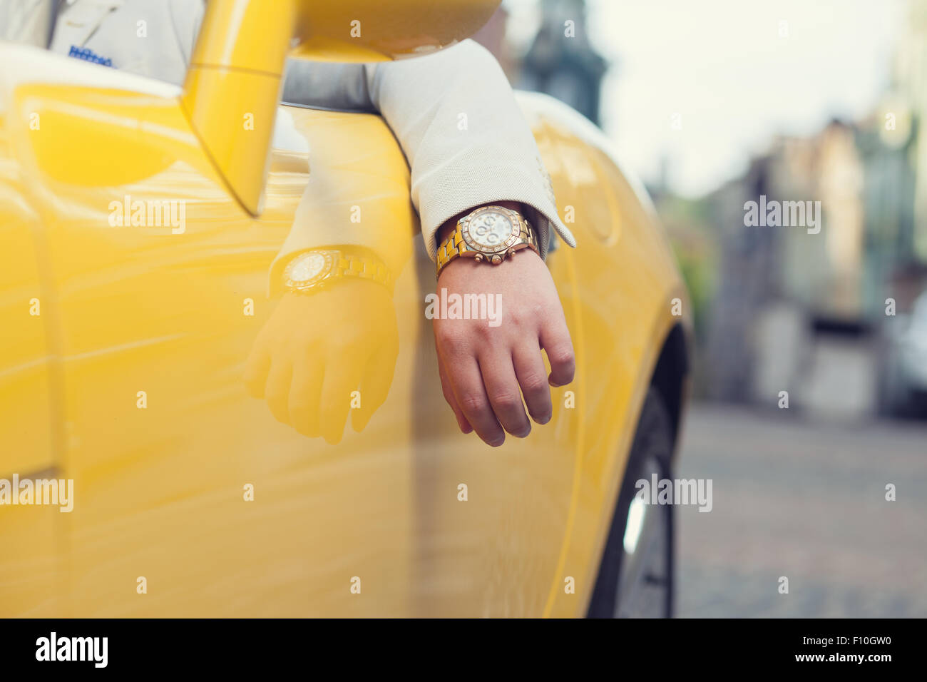 Man golden watch sports car hi-res stock photography and images - Alamy