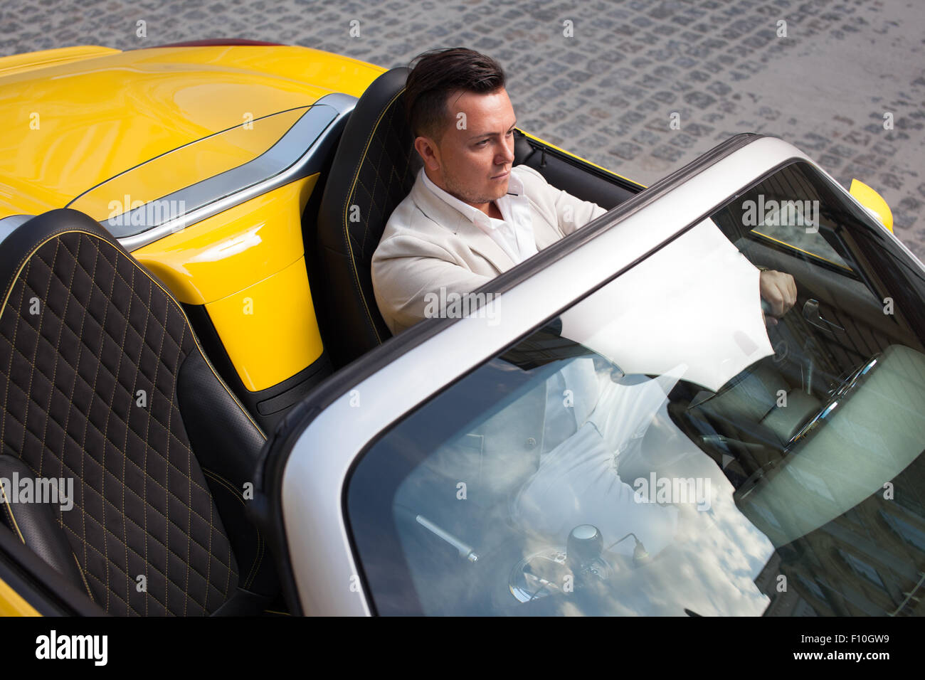 Man driving sport car Stock Photo - Alamy