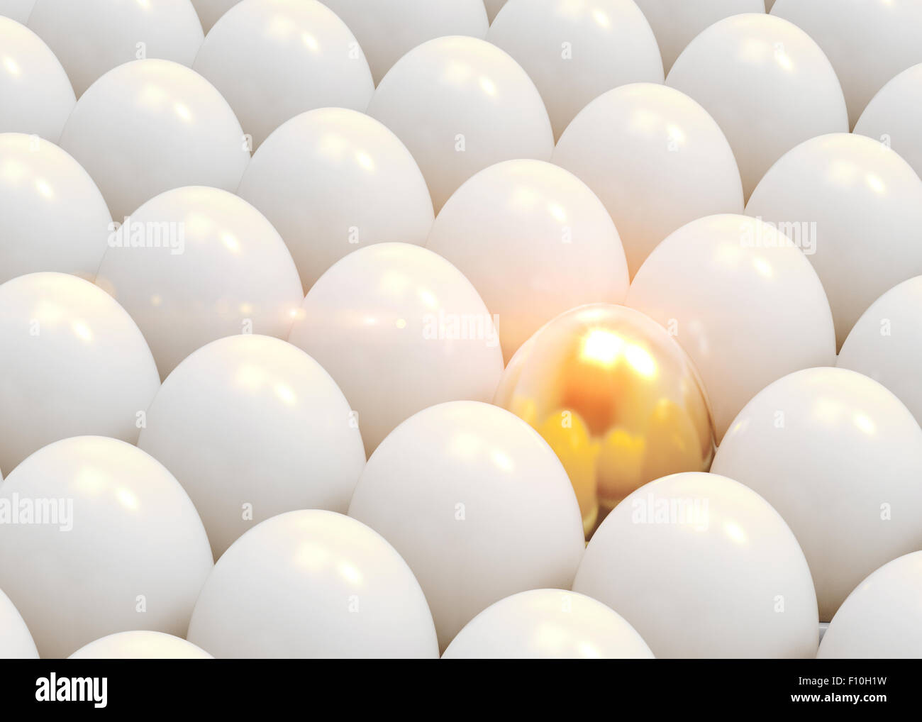 Golden egg among common eggs Stock Photo - Alamy