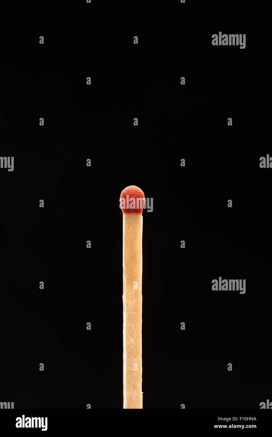 Red match isolated on black background Stock Photo - Alamy