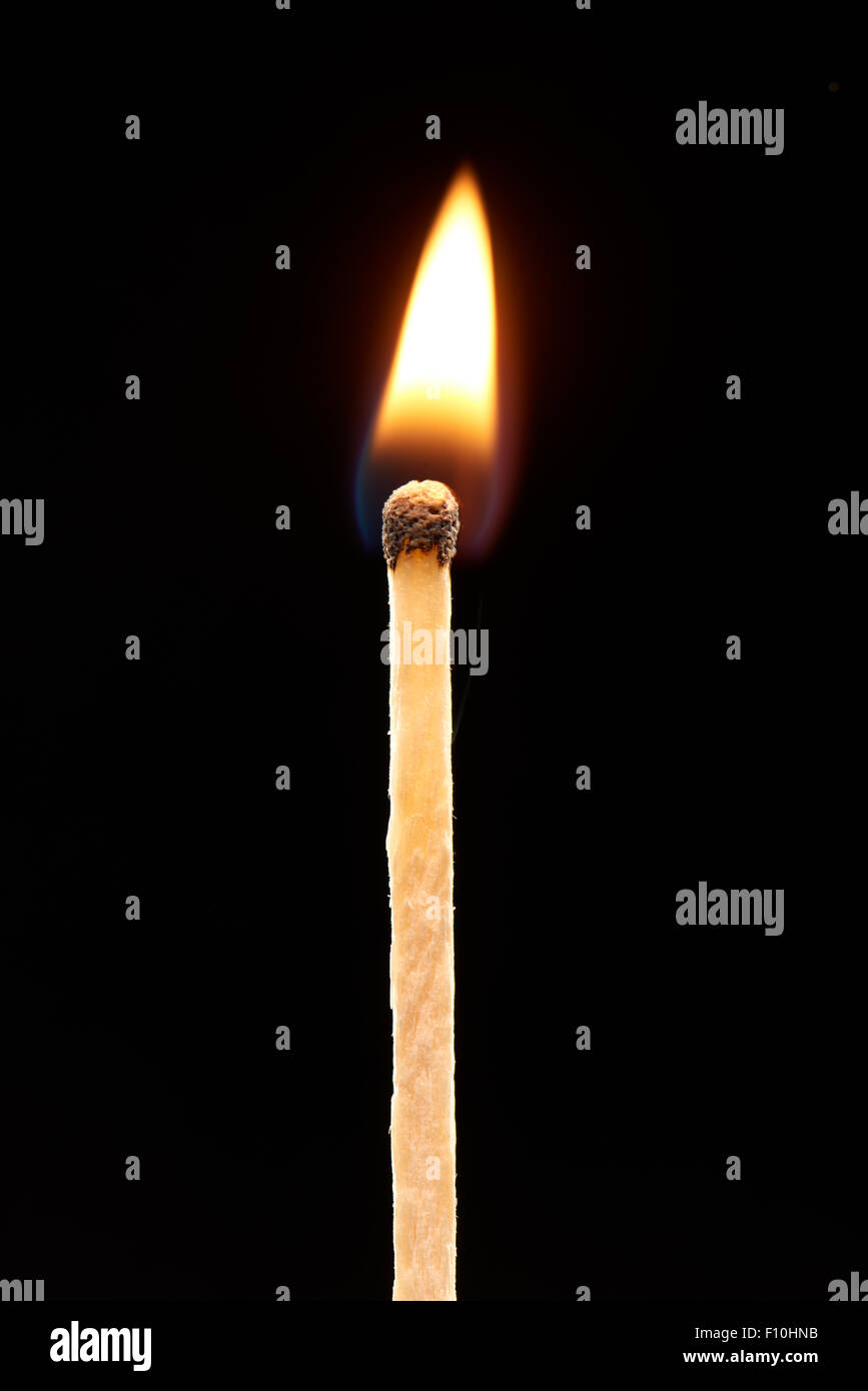 Burning match isolated on black background Stock Photo - Alamy