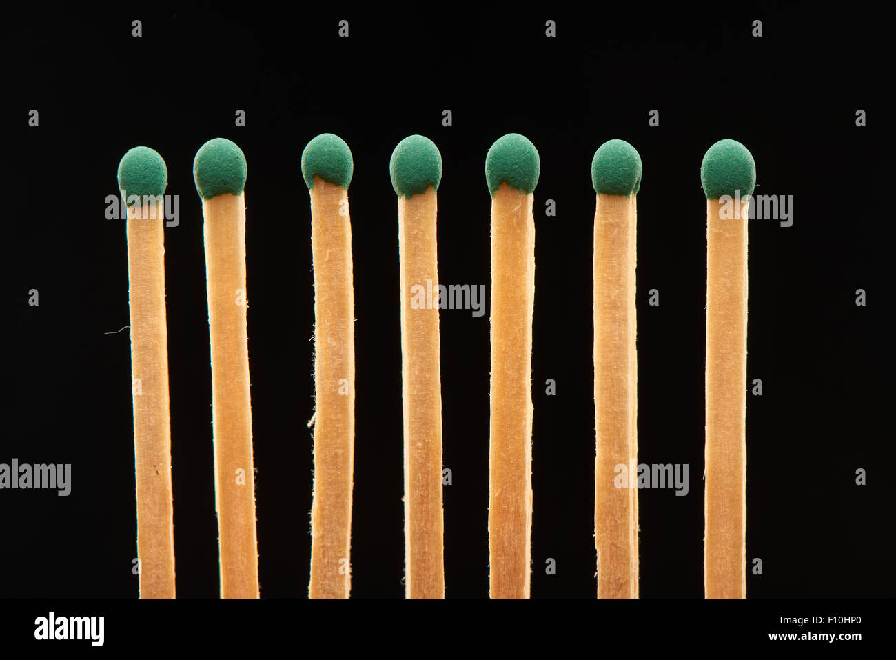 Set of seven green wooden matches isolated on black background Stock ...
