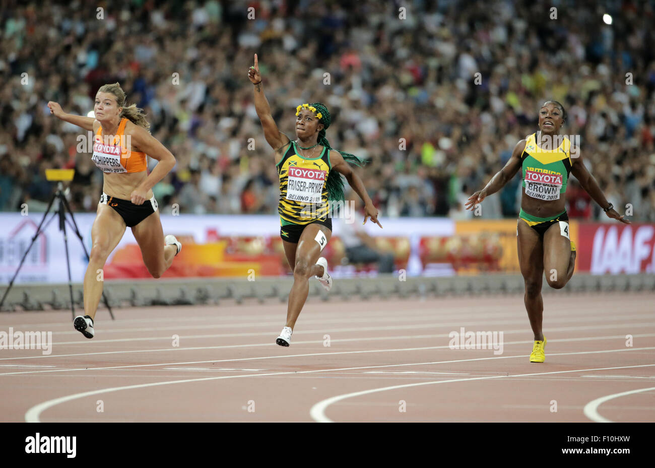 Beijing, China. 24th Aug, 2015. Shelly-Ann Fraser-Pryce (C) of Jamaica wins the women's 100m ...