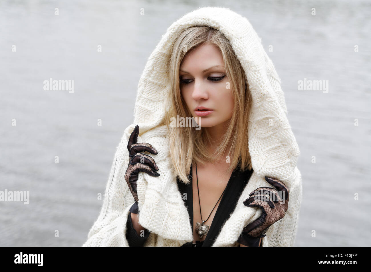 The girl in despair and grief against the river Stock Photo - Alamy