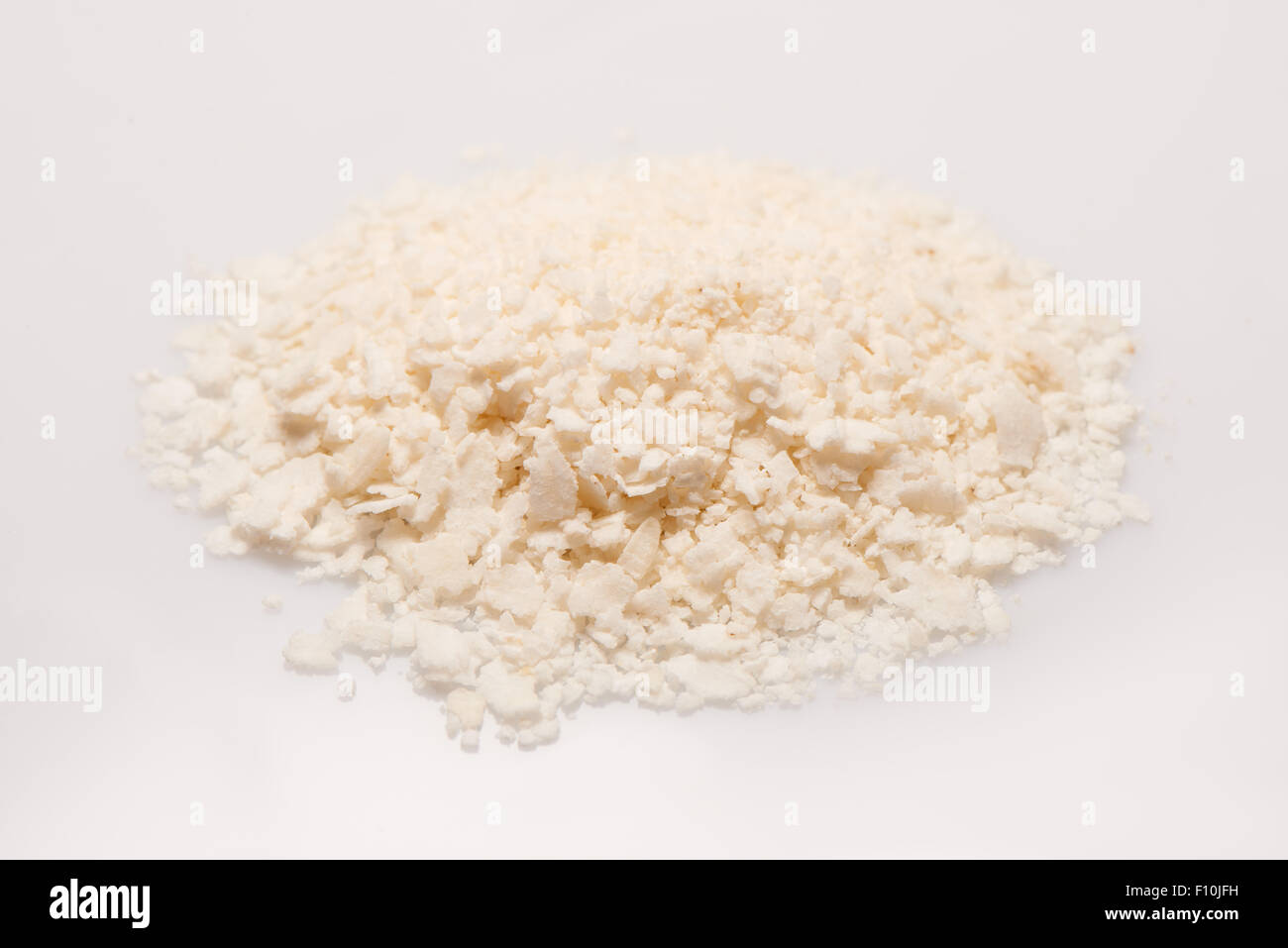 Pile of rice flakes on the white background Stock Photo - Alamy