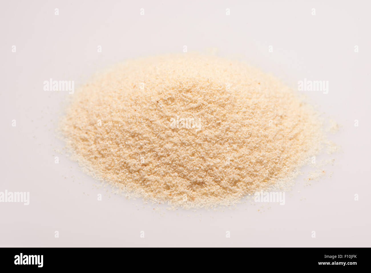Pile of semolina croup on the white background Stock Photo - Alamy