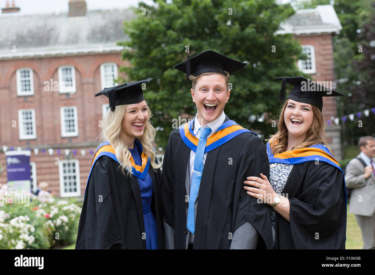 group of graduating university students after the ceremony in cap and ...
