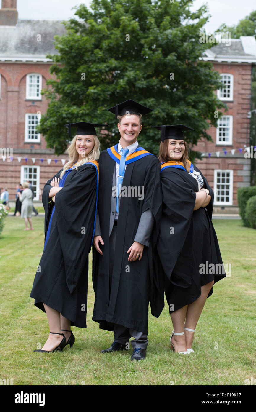 group of graduating university students after the ceremony in cap and ...