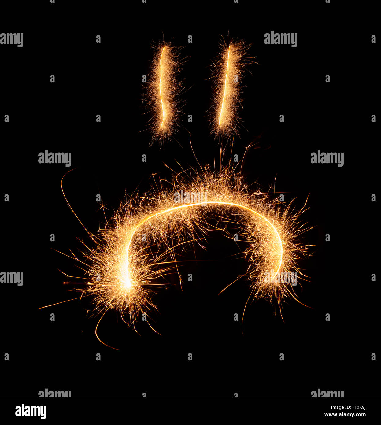 Upset weird sad smiley drawn with sparkles isolated on black background ...